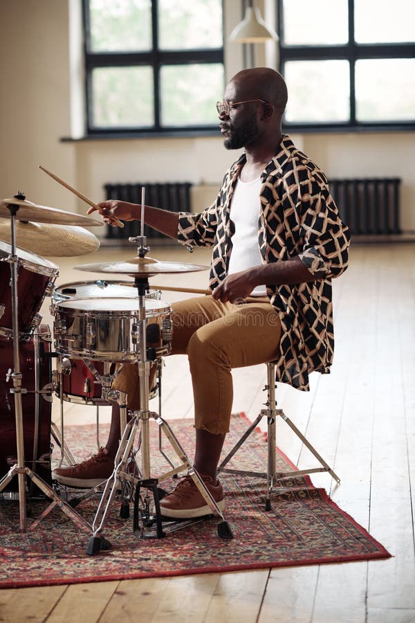 African Drummer Sitting at Drums Set Stock Photo - Image of eyewear ...