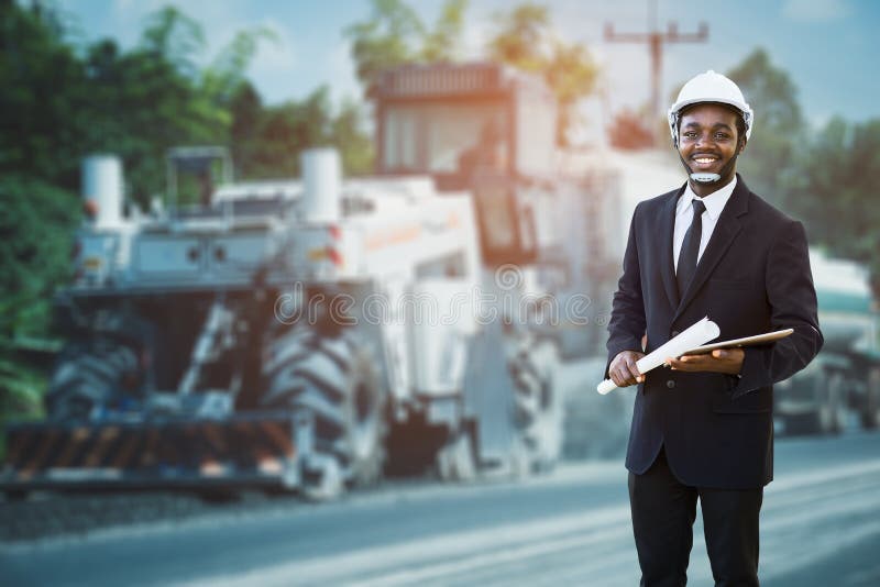 African Engineer Architecture Manager Holding a Tablet for Working on ...