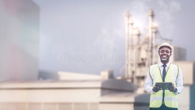 African Engineer Holding and Using Tablet Works at Factory.Engineering ...