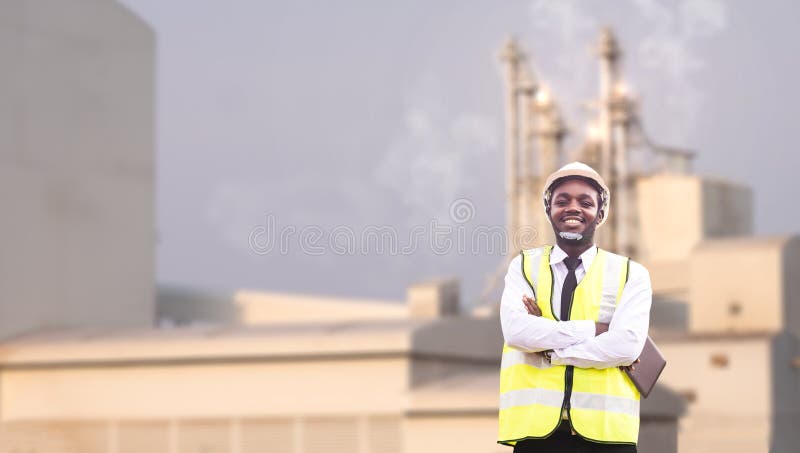 African Engineer Holding and Using Tablet Works at Factory.Engineering ...