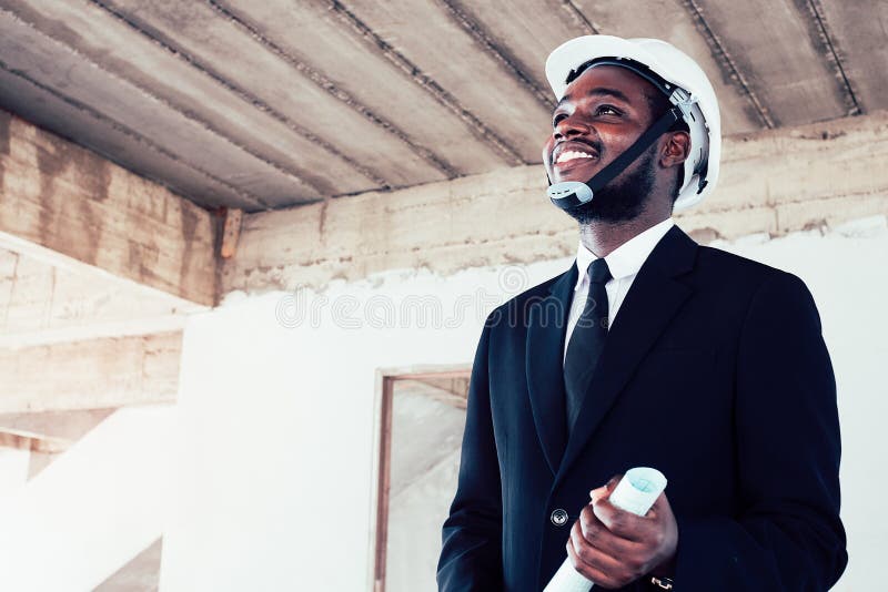 African Engineer Man Architect Looking and Holding Construction Project ...