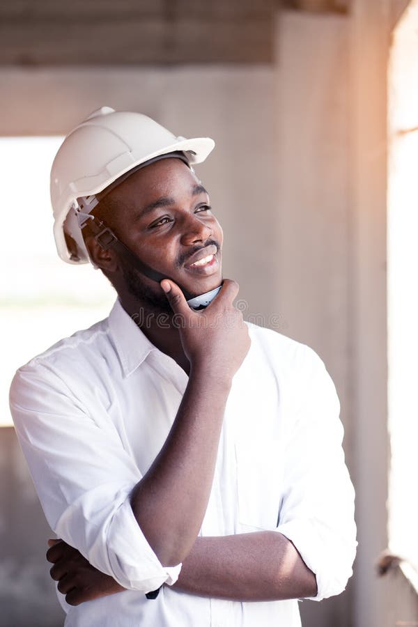 African Engineer Man Stand Up and Thinking Stock Image - Image of ...