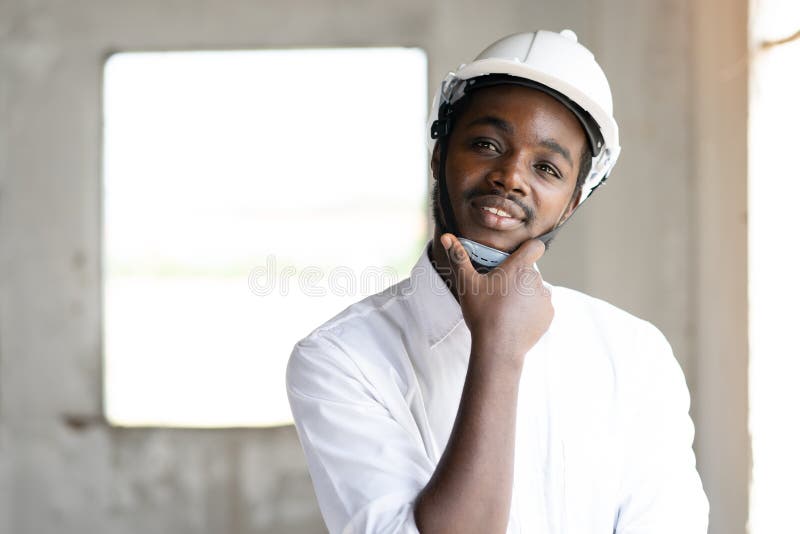 African Engineer Man Stand Up and Thinking Stock Image - Image of ...