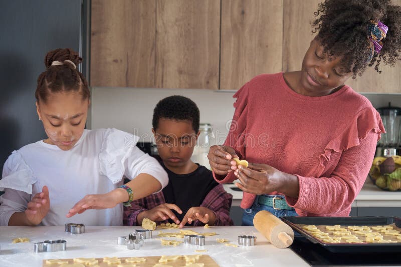 African Family Cutting Cookie Shapes in a Cookie Dough in the Kitchen ...
