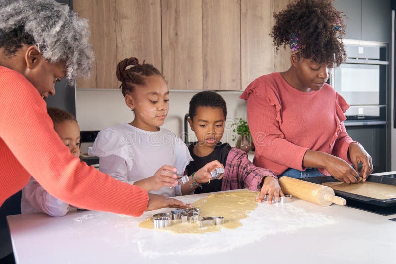 African Family Cutting Cookie Shapes in a Cookie Dough in the Kitchen ...