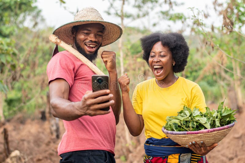 African Farmers Checking a Phone Together Stock Image - Image of ...