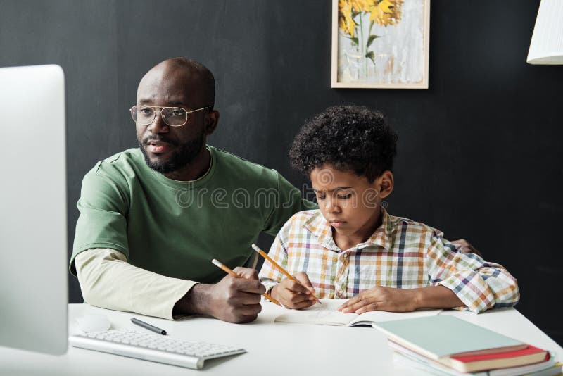 Father Studying with His Son at Home Stock Image - Image of family ...