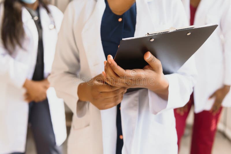 African Female Doctor Holding Paper. Stock Photo - Image of doctor ...