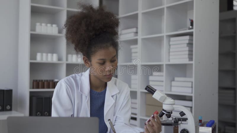 African Female Scientist in Laboratory Doing Experiment in Science Lab ...
