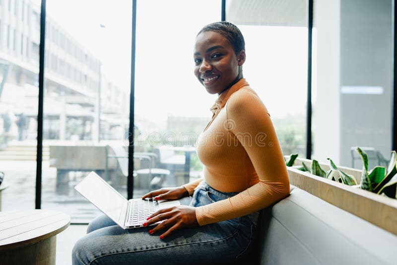 African Female Student Working on Computer in Public Place Stock Image ...