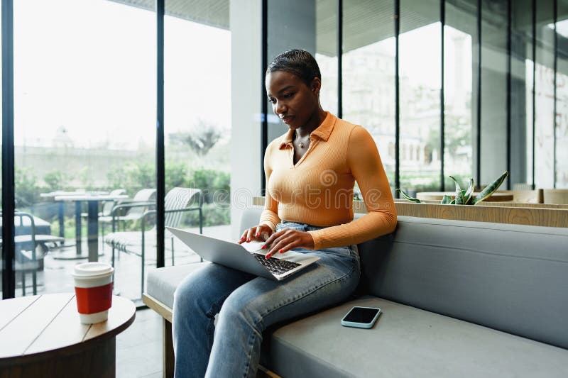 African Female Student Working on Computer in Public Place Stock Image ...