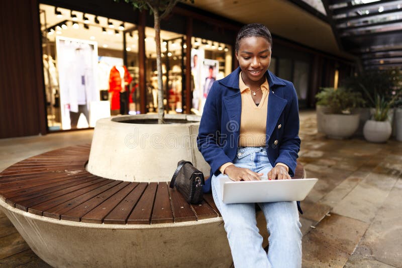 African Female Student Working on Computer in Public Place Stock Photo ...