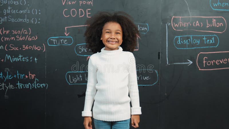 African Girl Smiling while Standing at Board with Code or Prompt ...