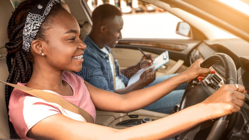African Girl Taking Driving Test with Professional Instructor Stock ...