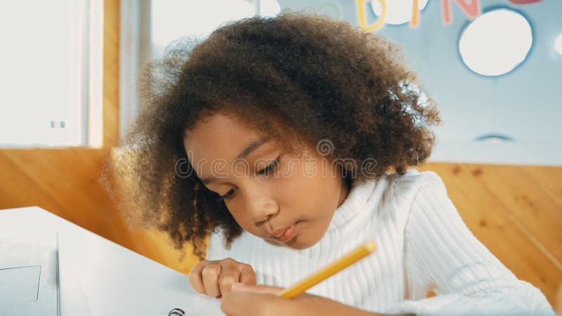 African Girl Writing Down on Paper Taking a Note To Solve a Problem ...