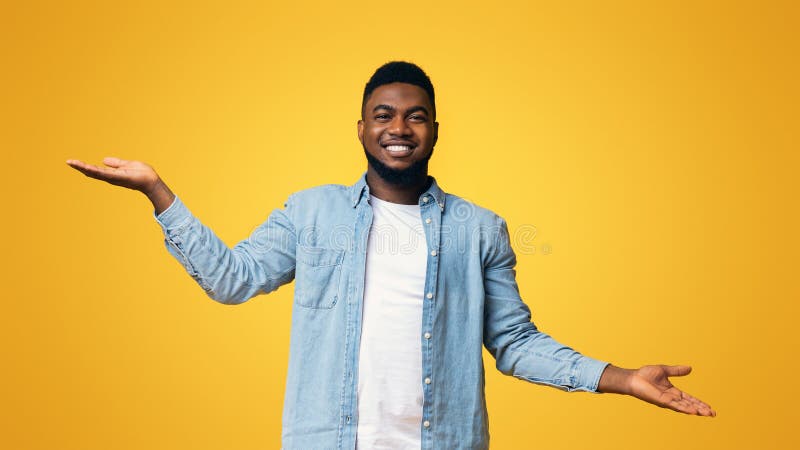 African Guy Comparing Variants, Making Scales with His Empty Hands ...