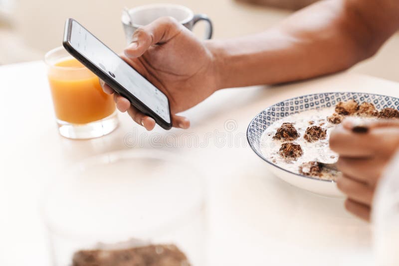 African Guy in the Morning Using Mobile Phone Stock Photo - Image of ...