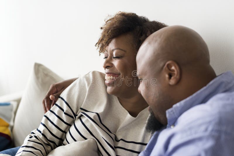African Happy Couple Relaxing at Home Stock Photo - Image of descent ...