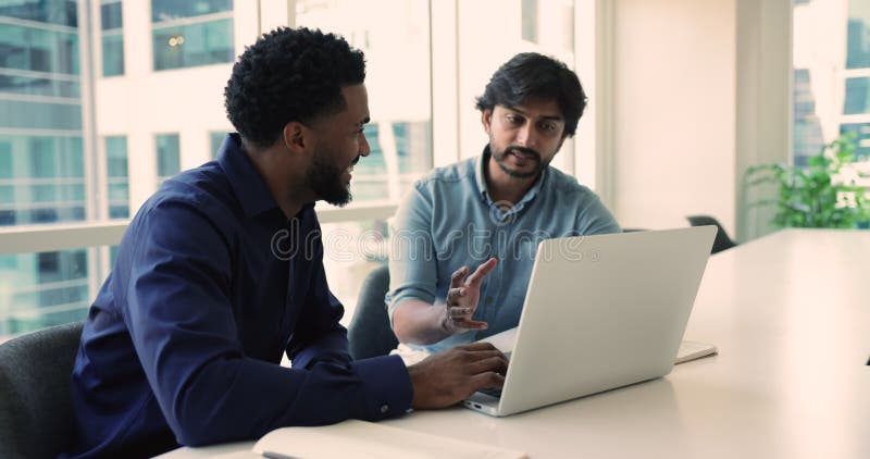 Male Employees Communicate in Office Working on Task Using Laptop Stock ...
