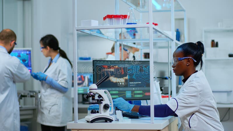 African Laboratory Scientist Working at Lab with Test Tubes Stock Photo ...