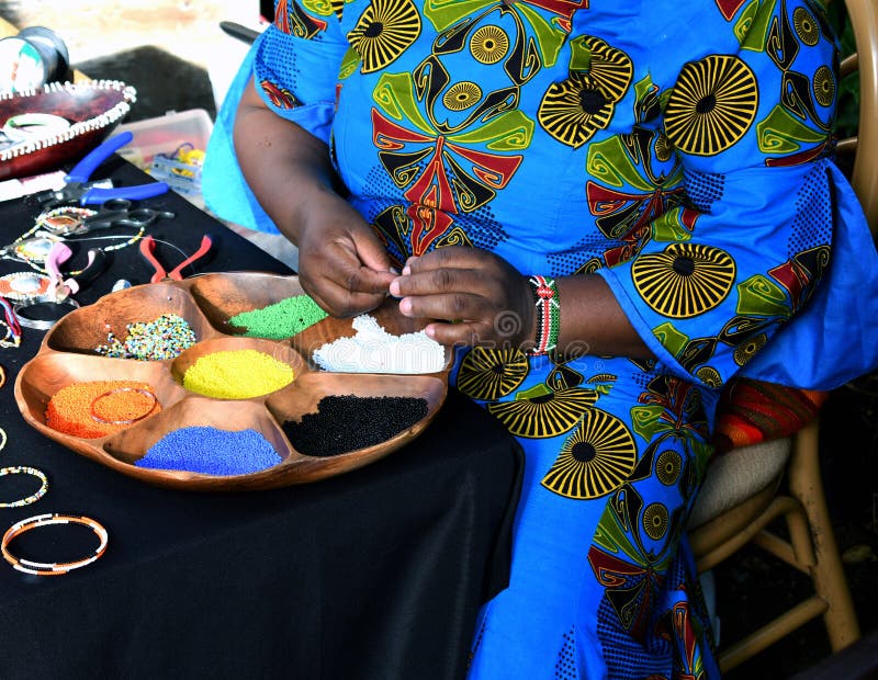 African Lady Creating Unique Necklaces Stock Photo - Image of gras ...