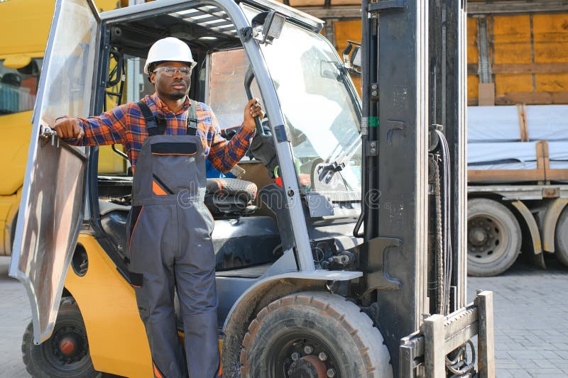African Logistics Man As a Forklift Driver in the Warehouse of a ...