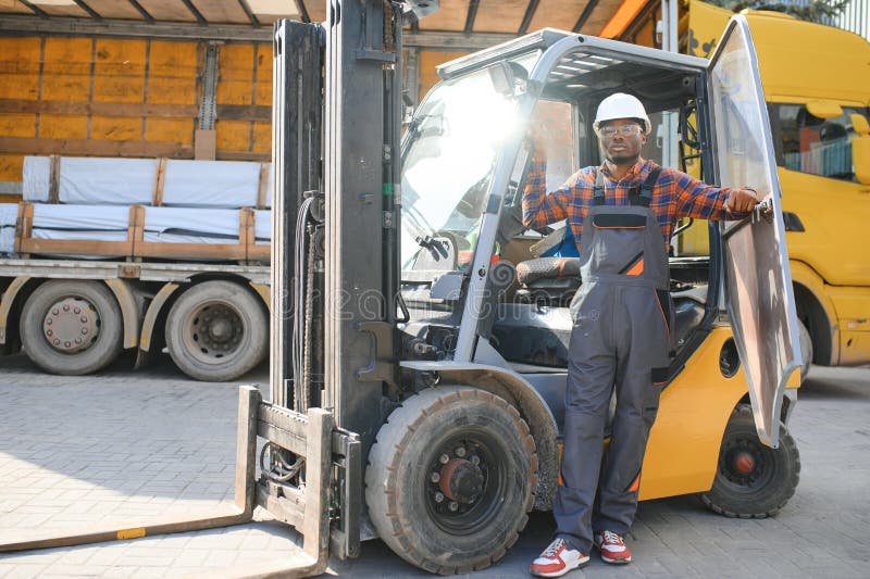 African Logistics Man As a Forklift Driver in the Warehouse of a ...