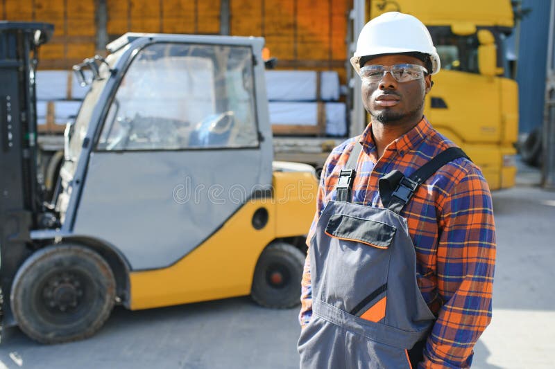 African Logistics Man As a Forklift Driver in the Warehouse of a ...