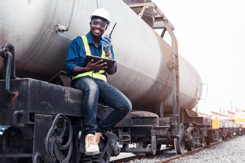 African Male Engineer Control a the Train on Railway with Talking by ...