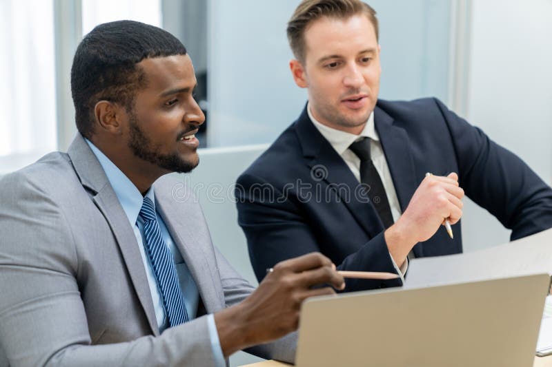 African Male Leader Explain Strategy while Show Solution To Manager ...