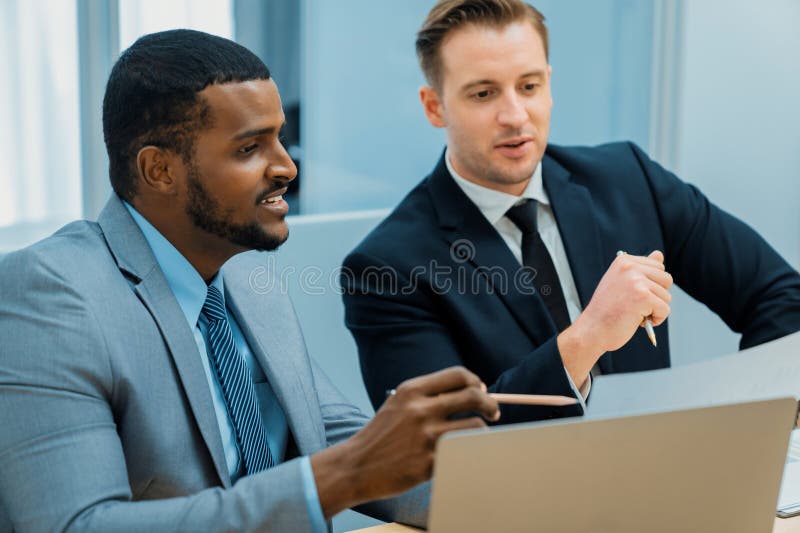 African Male Leader Explain Strategy while Show Solution To Manager ...