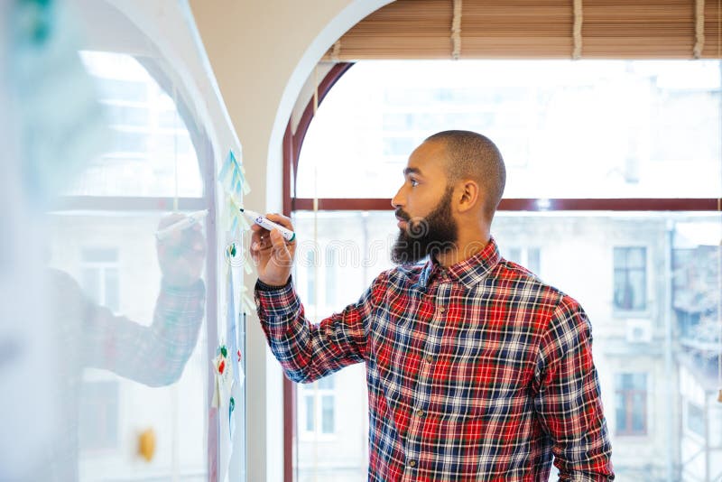African Man with Beard Standing and Writing on Whiteboard Stock Image ...