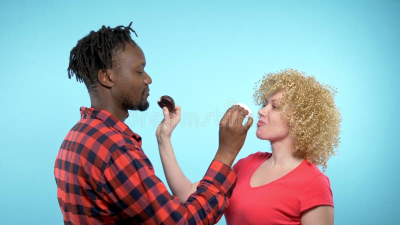 African Guy And Caucasian Girl Making Selfie With Smartphone Blue