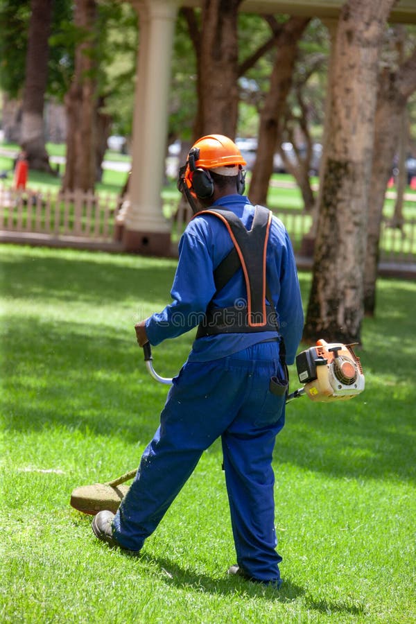 African Man Cutting The Lawn Stock Photo - Image of gardener, farmer ...