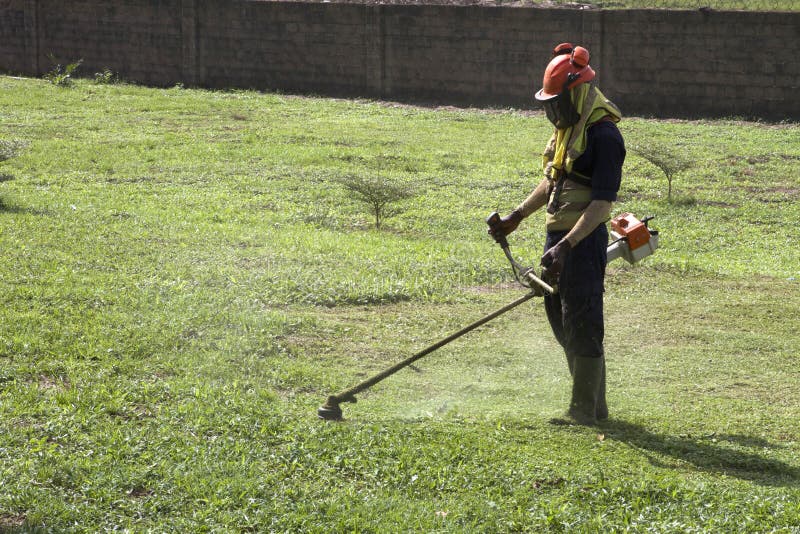 African Man Cutting the Lawn Stock Photo - Image of gardener, farmer ...