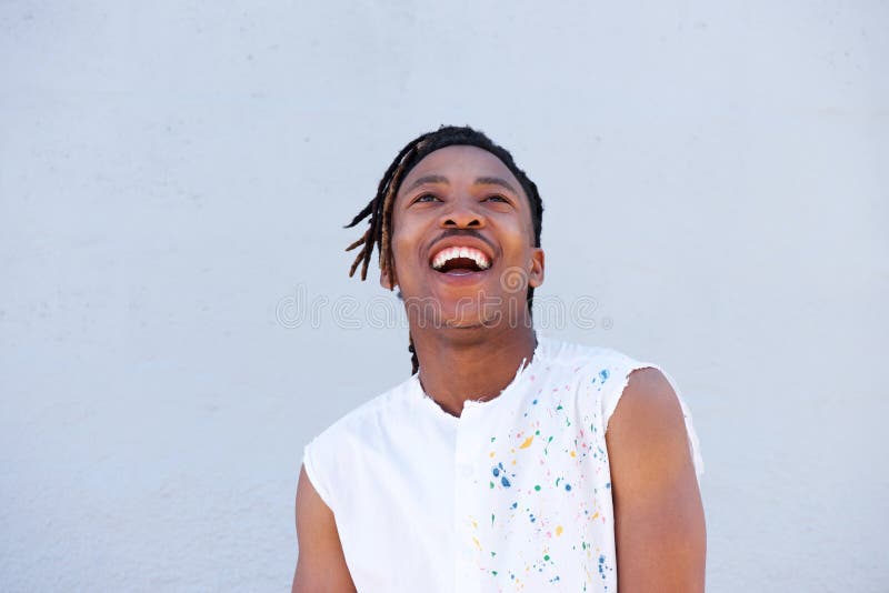 African Man with Dreadlocks Laughing and Looking Up Stock Image - Image ...
