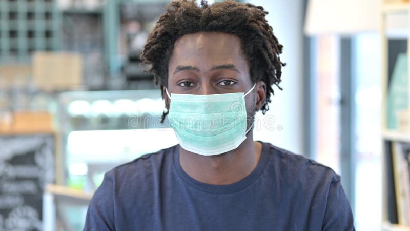 African Man with Face Mask Looking at Camera Stock Photo - Image of ...