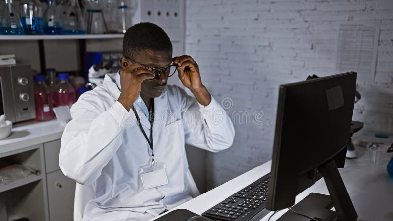 African Man in Lab Adjusting Glasses with Computer, Science, Healthcare ...
