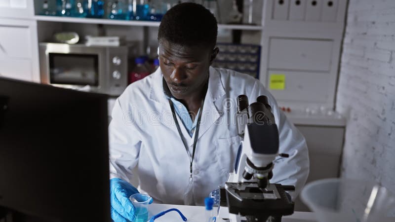 Man in a Lab Coat Using a Microscope To Examine a Sample, Suitable for ...