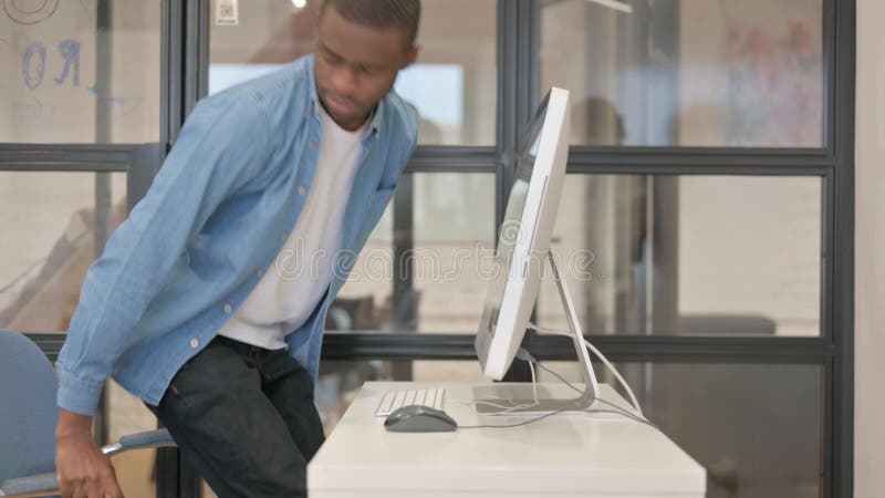 African Man Leaving Office after Working on Computer Stock Video ...
