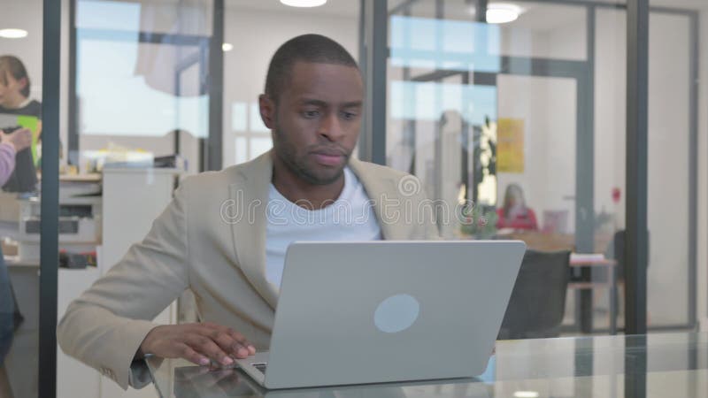 African Man Leaving Office after Working on Computer Stock Footage ...