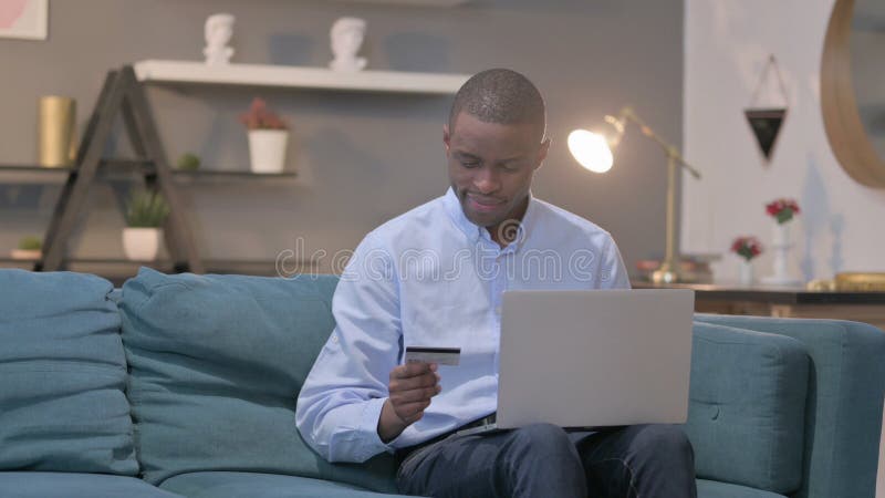 African Man Making Successful Online Payment on Laptop Stock Photo ...