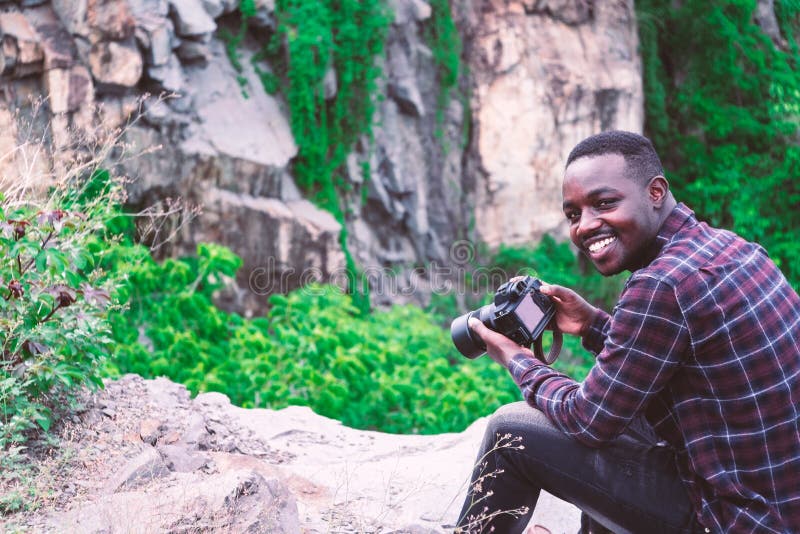 African Man Photographer Taking a Camera Stock Photo - Image of ...