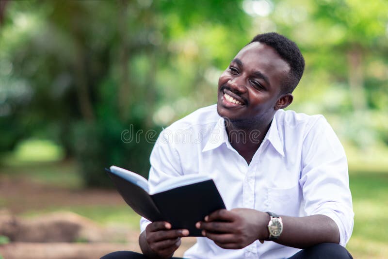 African Man Reading a Book in the Park Stock Image - Image of nature ...