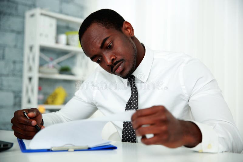 African Man Reading Document Stock Image - Image of paperwork ...