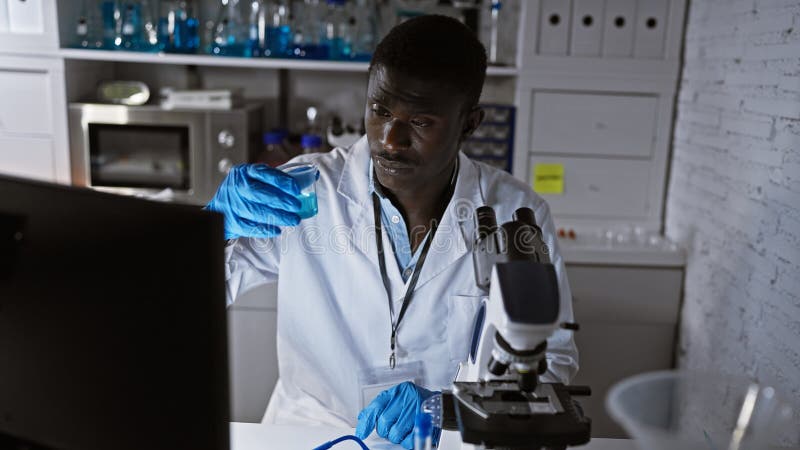 African Man Scientist Analyzing Liquid in Laboratory Stock Image ...
