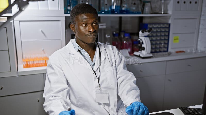 African Man Scientist in Lab Coat Working in a Laboratory with ...