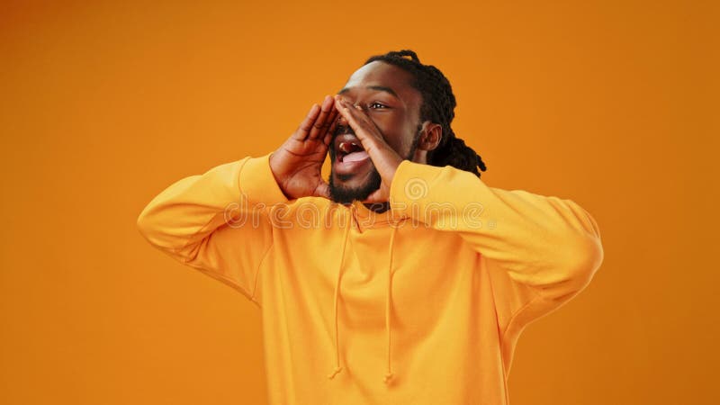 African Man Shouting and Screaming on Yellow Background Stock Video ...