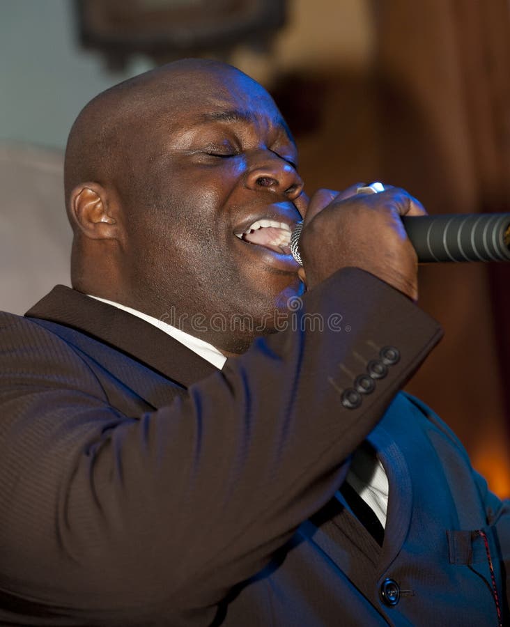 African man singing live stock image. Image of singing - 23571395