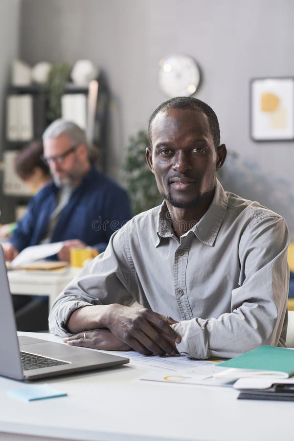 African Man Sitting at Office Stock Image - Image of indoors ...